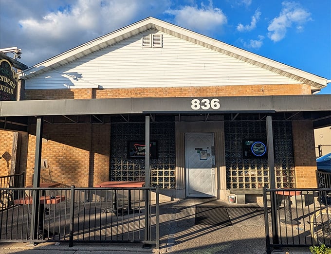 The unassuming brick exterior of Slyder's Tavern stands as a beacon to those who know that culinary treasures often hide in plain sight.