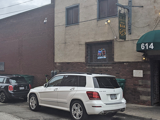 The unassuming entrance to burger paradise. Johnny's Little Bar hides behind this modest door, proving great food doesn't need flashy signage to be legendary.