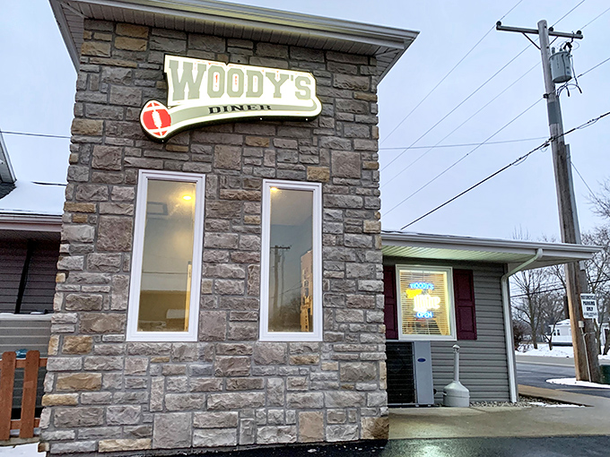 The stone facade of Woody's Diner stands like a culinary fortress in Russells Point, promising comfort food treasures within its unassuming walls.