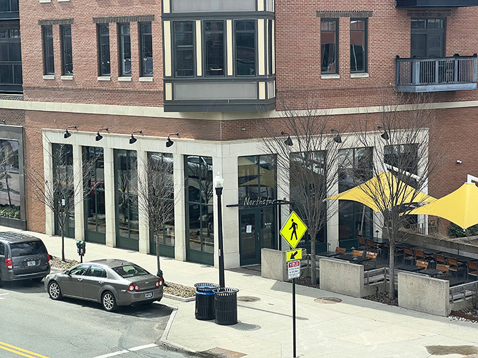 The sleek exterior of Northstar Cafe beckons like a culinary lighthouse in Columbus' Short North district, promising good things to those who enter.