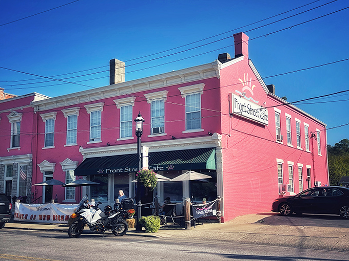 The pink landmark that promises culinary delight! Front Street Caf&eacute;'s vibrant exterior stands proudly along the Ohio River, beckoning hungry travelers with unmistakable charm.