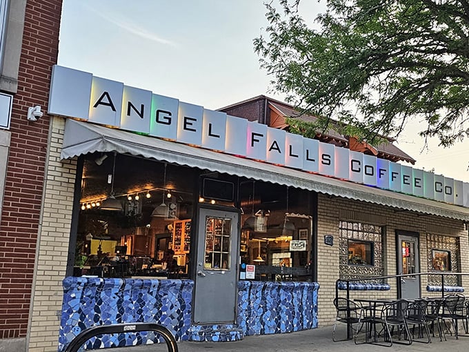 The colorful mosaic-like sign of Angel Falls Coffee beckons like a caffeinated rainbow against Akron's skyline. Coffee paradise found!