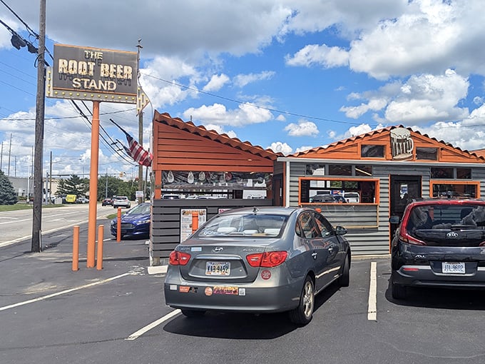 The Root Beer Stand's classic architecture whispers sweet nothings about simpler times when chrome and neon ruled the road.