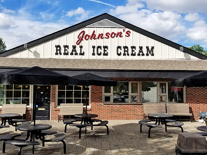 The classic white-gabled facade of Johnson's beckons like an ice cream lighthouse, guiding sweet-toothed pilgrims to their creamy destination since 1950.