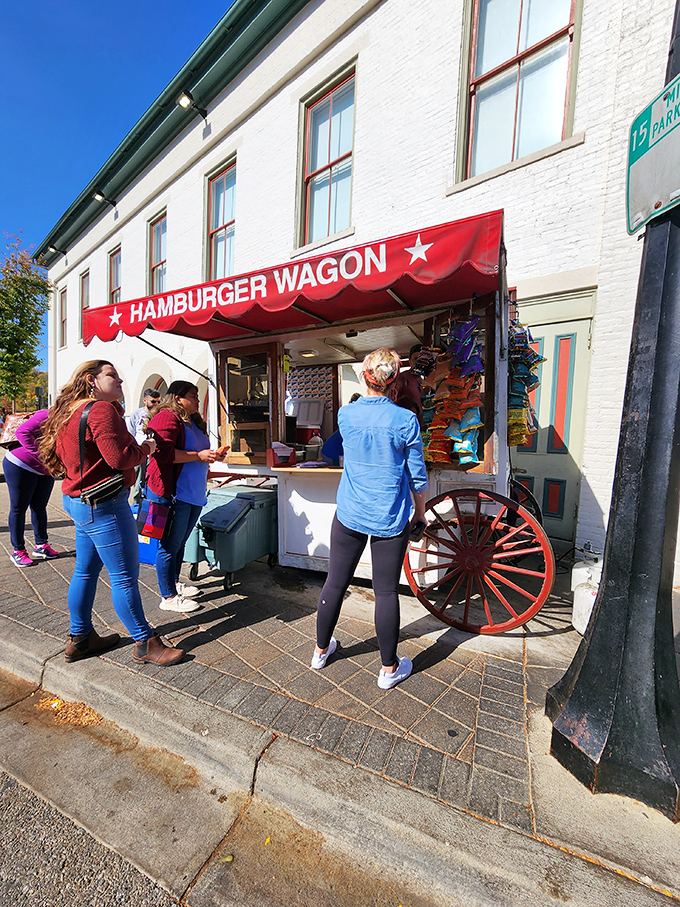 That red awning waves like a culinary flag of surrender &ndash; resistance is futile when burgers call.
