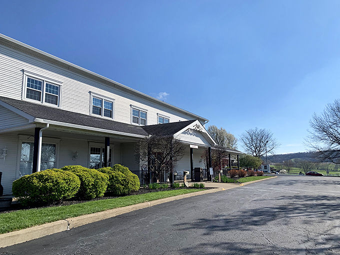 The welcoming white exterior of Amish Door Restaurant stands like a beacon of comfort food against Ohio's rolling countryside, promising delicious memories before you even step inside.