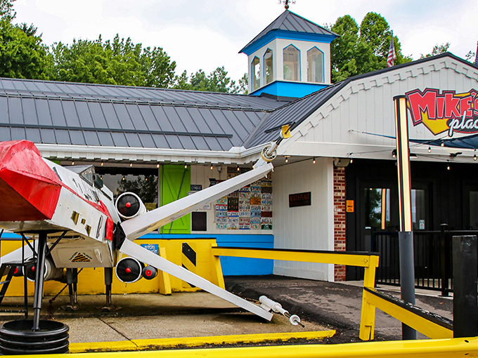 Yes, that's an actual airplane on the roof! Mike's Place in Kent doesn't just serve food—it delivers a full-scale visual adventure before you even walk in.