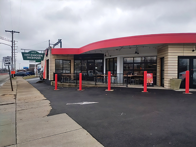 The bright red awning and distinctive green sign serve as a beacon for fried chicken pilgrims. This unassuming storefront houses Columbus' worst-kept culinary secret.