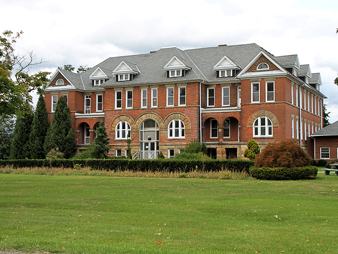 The imposing red brick fa&ccedil;ade of Madison Seminary stands proudly against the Ohio sky, its windows like watchful eyes surveying all who approach.