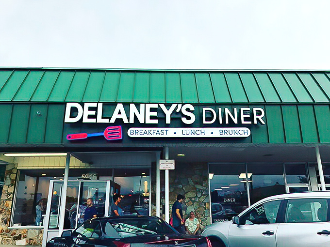 Delaney's Diner stands proudly with its signature green roof, like a beacon calling hungry breakfast enthusiasts from across Westerville.