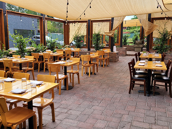 The bold red exterior of Ox Restaurant stands like a carnivore's lighthouse, beckoning hungry Portlanders with promises of flame-kissed delights.