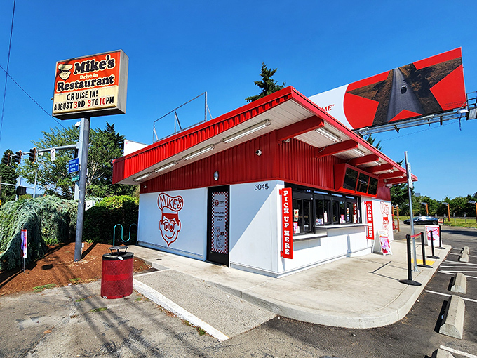 The bright red exterior of Mike's Drive-In stands as a beacon of burger hope in Milwaukie, where nostalgia meets hunger in perfect harmony.