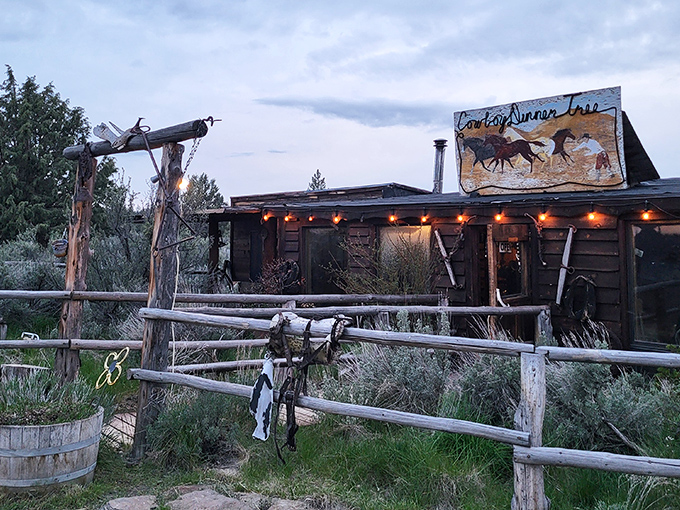The rustic exterior of Cowboy Dinner Tree stands defiant against Oregon's high desert, like a time capsule from the Wild West that refuses to be buried.
