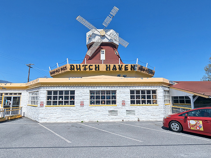 The iconic windmill atop Dutch Haven stands like a sugary lighthouse, beckoning hungry travelers on Route 30 with promises of Pennsylvania Dutch delights.