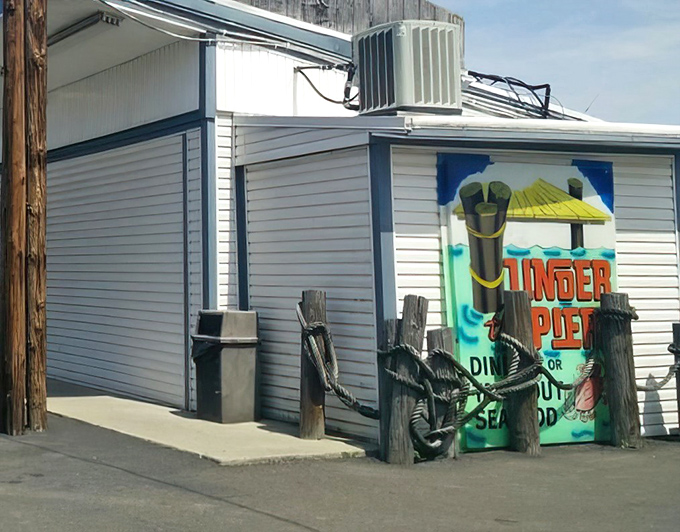 The unassuming exterior of Under the Pier looks like a movie set where seafood dreams and nautical nostalgia collide&mdash;complete with those charming porthole windows.