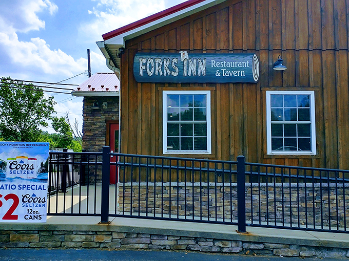 Stone meets sky at Fork's Inn, where that iconic red roof signals you've arrived at flavor headquarters in Ligonier.