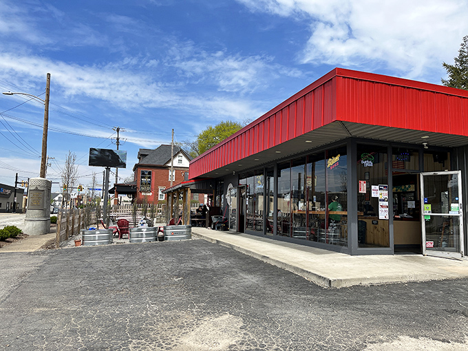 That red awning isn't just a design choice &ndash; it's a beacon calling hungry souls to smoky salvation.