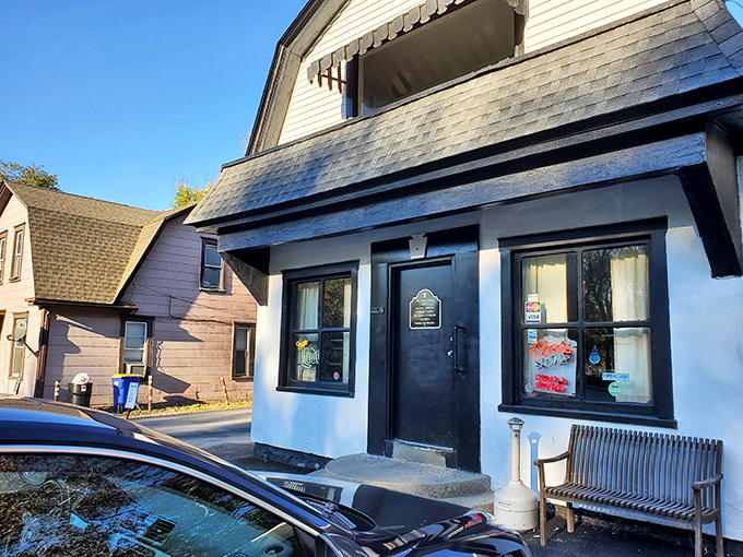 The unassuming exterior of Glass Lounge in Harrisburg hides culinary treasures within. Classic white building, modest signage&mdash;the perfect disguise for burger greatness.