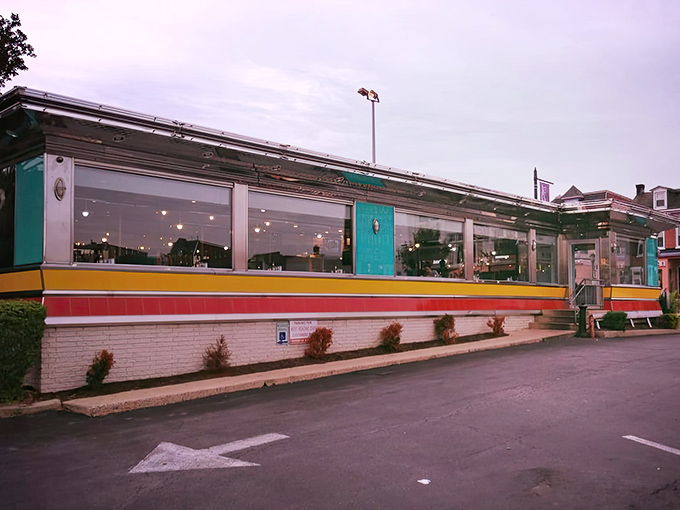 The classic stainless steel exterior with vibrant stripes promises comfort food nirvana before you even step inside.