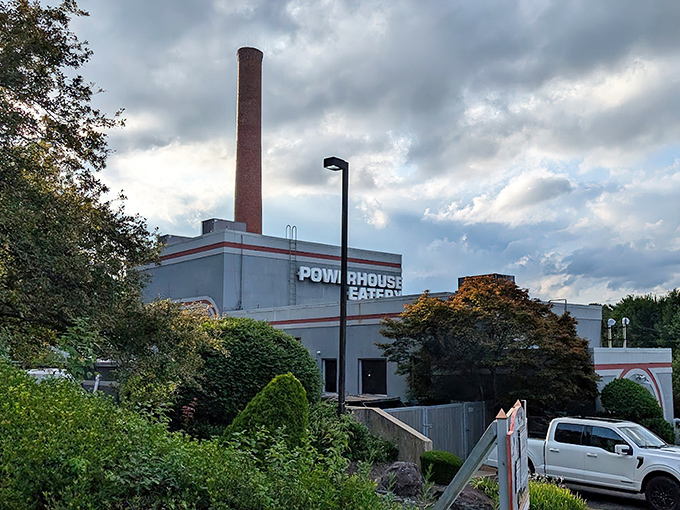 The iconic smokestack stands sentinel over Powerhouse Eatery, a beacon of culinary delight nestled among Pennsylvania's rolling hills.