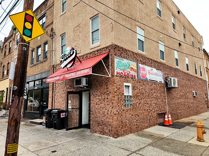The corner brick building with its iconic red awning stands like a sandwich sentinel in South Philly, beckoning hungry pilgrims from blocks away.