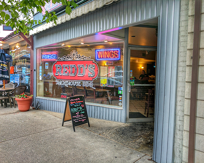 The neon-lit promise of "RIBS" and "WINGS" at Redd's isn't just advertising&mdash;it's a beacon of hope for barbecue pilgrims seeking salvation in Carlisle.
