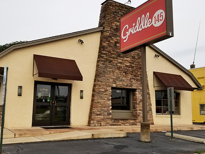 The red "Griddle 145" sign welcomes hungry breakfast seekers, while the "Kindness is Key" message hints at the warmth waiting inside.