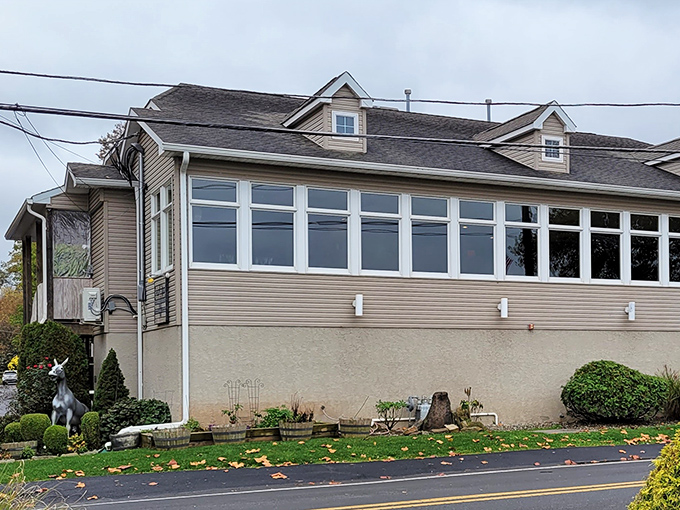 The unassuming exterior of Charcoal BYOB glows with promise as night falls, like a culinary lighthouse beckoning hungry travelers to safe harbor.