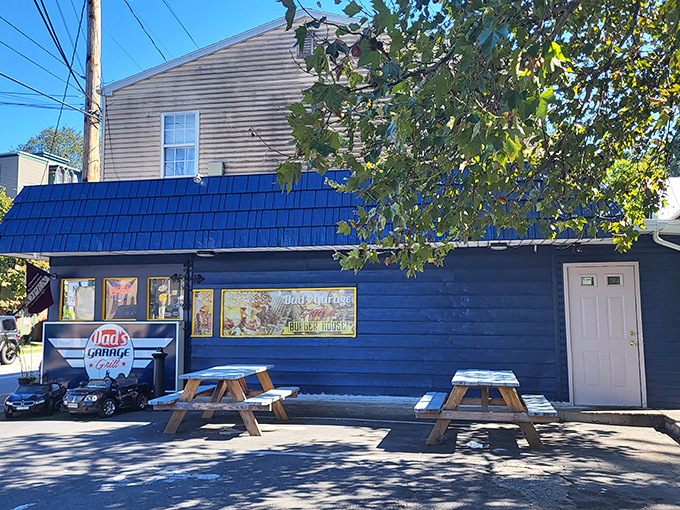 The blue exterior of Dad's Garage isn't just a restaurant&mdash;it's a time machine with kid-sized cars that'll make you wish you were eight again.