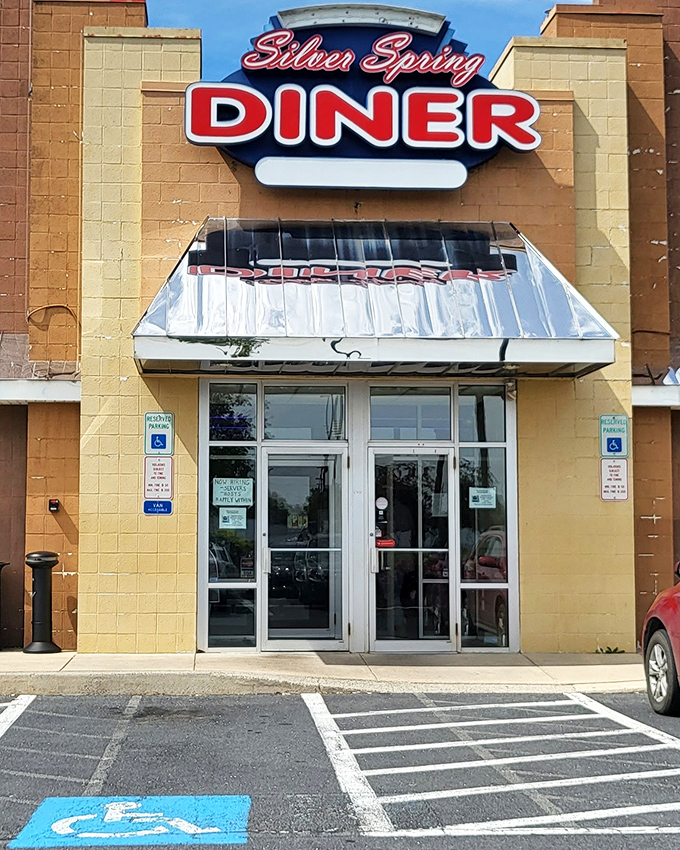 The neon glow of Silver Spring Diner beckons hungry travelers like a lighthouse for the breakfast-starved. Classic diner architecture with modern touches creates an irresistible roadside charm.