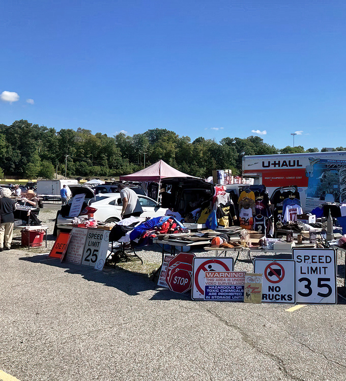 Treasure hunting begins under clear blue Pennsylvania skies, where vintage road signs meet modern bargain hunters in Trader Jack's sprawling outdoor marketplace.