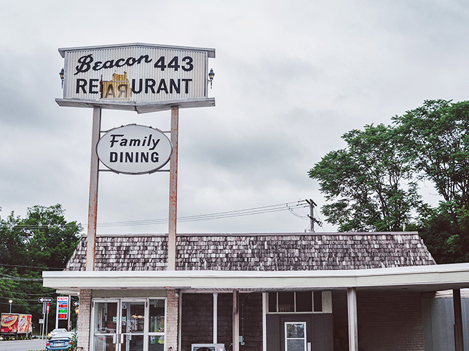 The classic roadside sign for Beacon 443 stands as a welcoming sentinel, promising "Family Dining" that generations of Pennsylvanians have come to trust.