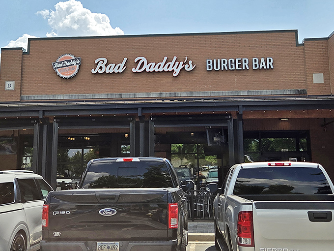 The brick facade of Bad Daddy's beckons hungry travelers like a burger lighthouse on Woodruff Road's sea of retail options.