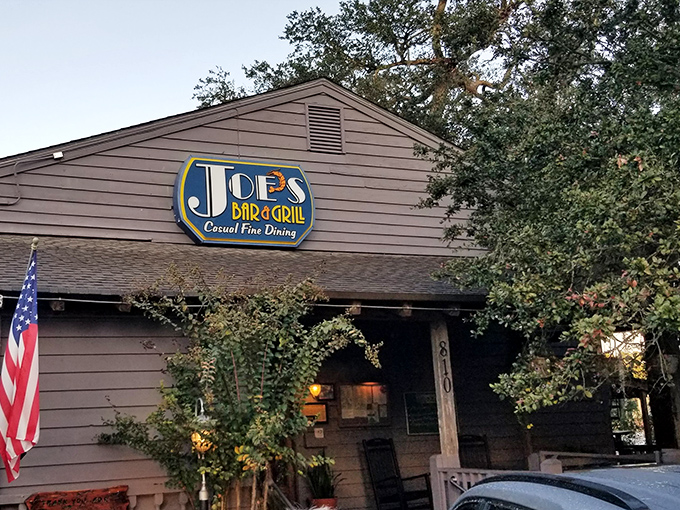 Tucked beneath Spanish moss and live oaks, Joe's Bar & Grill's unassuming exterior hides culinary treasures that locals have cherished for years.
