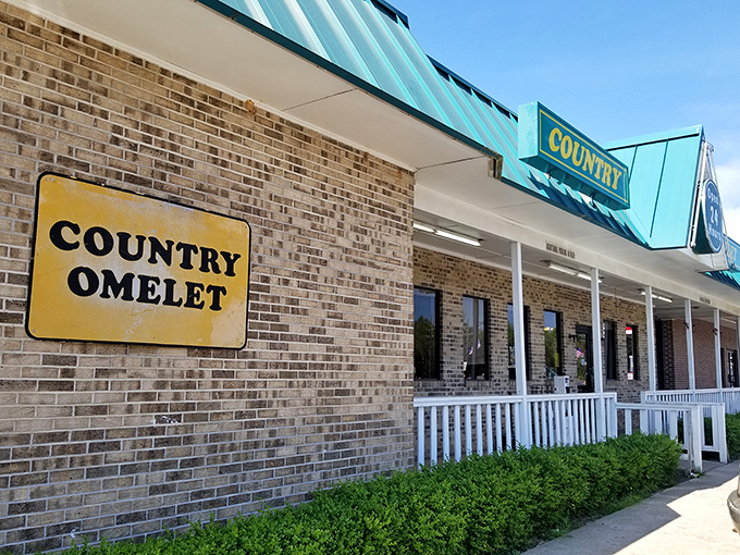 The unassuming exterior with its distinctive green roof and white picket fence might not scream "food destination," but locals know better. Breakfast paradise awaits!