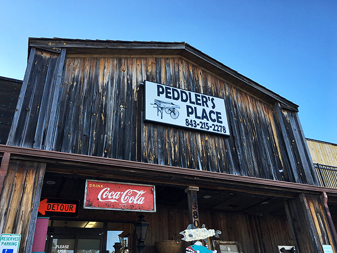 The weathered wooden facade of Peddler's Place isn't just rustic charm&mdash;it's a warning sign that your wallet is about to experience a joyful lightening.