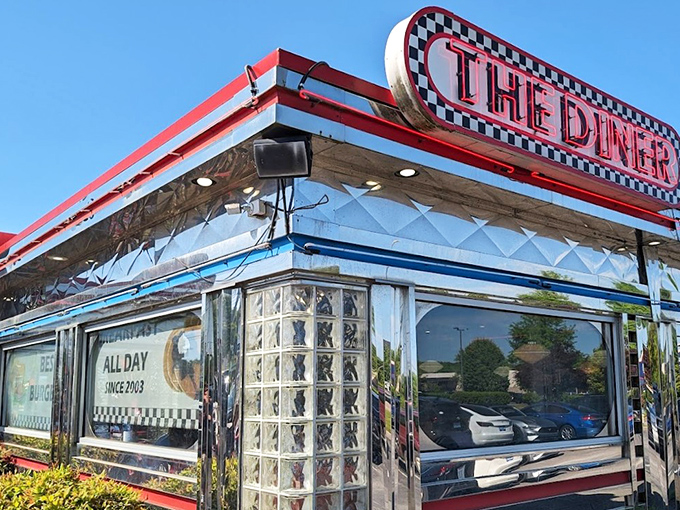 The gleaming chrome exterior of THE DINER shines like a beacon of hope for hungry travelers. This isn't just a restaurant—it's a time machine with a menu.