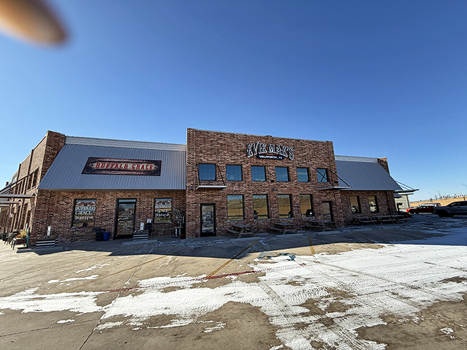 The brick fortress of flavor that houses Evie Mae's stands proudly against the Texas sky, a beacon for barbecue pilgrims seeking smoked meat salvation.