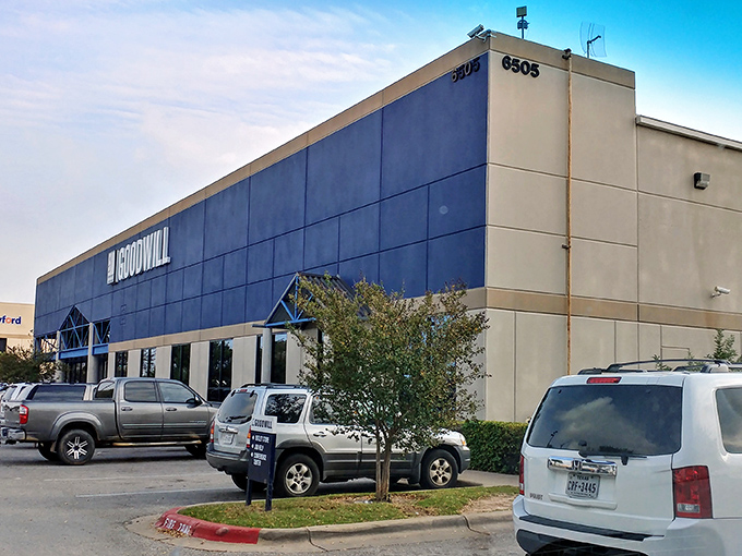 The blue-fronted facade of Goodwill Outlet South stands like a treasure chest waiting to be opened. Austin's bargain hunters know this isn't just any thrift store.