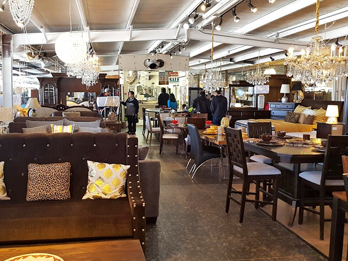 Chandeliers that would make Liberace jealous hang above an impressive furniture showroom where yesterday's living rooms await tomorrow's memories.