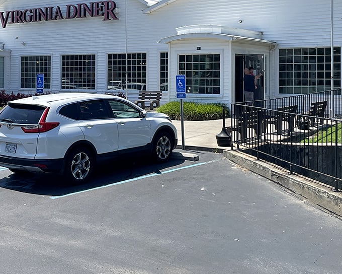 The iconic white clapboard exterior with bold red lettering promises Southern comfort before you even step inside. A roadside beacon of deliciousness.