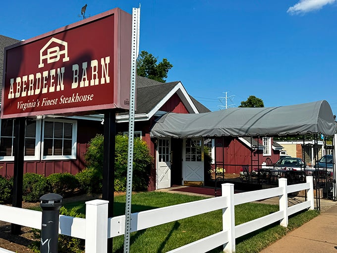 The barn-red exterior with white trim isn't just charming&mdash;it's a promise of the comfort food paradise waiting inside. String lights add a touch of magic to outdoor dining.