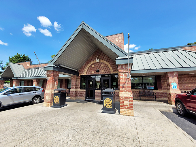 The brick-and-green-roof charm of Wood Grill Buffet stands ready to welcome hungry Virginians like a culinary lighthouse guiding famished travelers home.