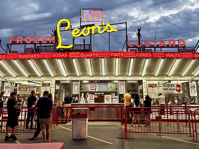 The iconic neon signage of Leon's glows like a beacon of dairy-based hope against the Milwaukee sky, a mid-century masterpiece that's outlasted countless food trends.