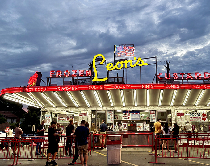 Neon dreams and custard schemes - Leon's glowing facade promises frozen perfection under Milwaukee skies.