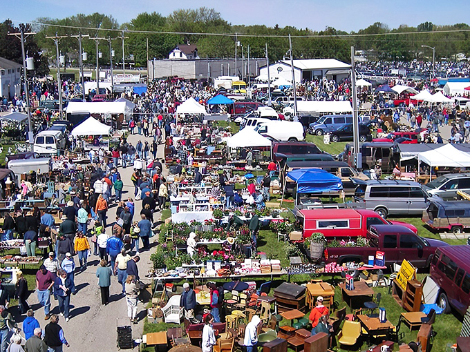 The bustling fairgrounds transform into a treasure hunter's paradise, where crowds navigate a maze of vendors offering everything from Victorian furniture to vintage fishing lures.