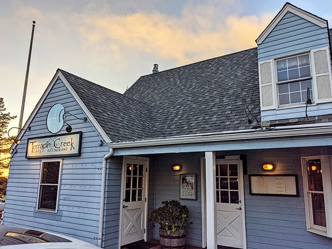 The blue clapboard exterior of Terrapin Creek stands like a coastal sentinel, promising seafood treasures within its unassuming walls.