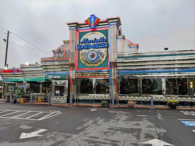 The neon-drenched facade of Marietta Diner glows like a beacon of comfort food hope on Cobb Parkway, promising delicious salvation 24 hours a day.