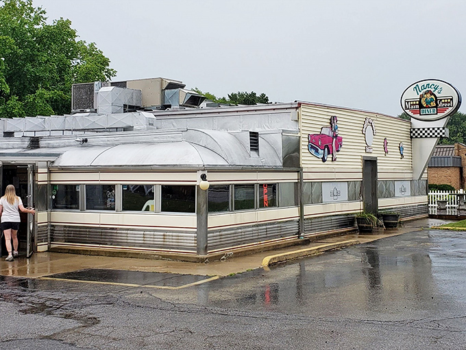 The gleaming stainless steel exterior of Nancy's Main Street Diner stands like a time capsule on Grafton's Main Street, beckoning hungry travelers with promises of comfort food perfection.