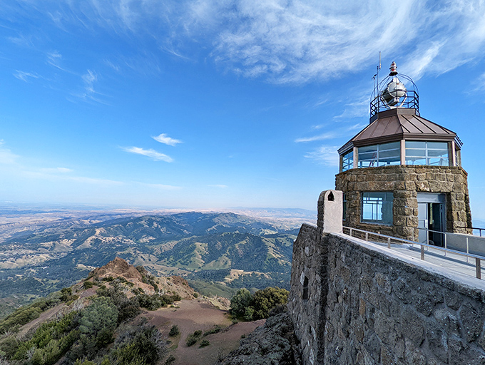 The historic stone observation tower stands like a sentinel at 3,849 feet, offering views that make your Instagram followers think you chartered a private plane.